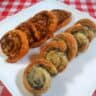 vegan savory puff pastry snails with poppy-parmesan and pizza